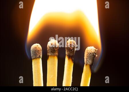 Bundles of burning matches in front of black Background, Close-up Stock ...