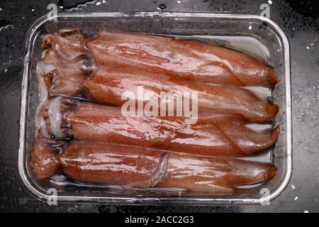top view fresh raw squids ready to be cooked Stock Photo - Alamy