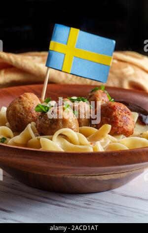 Swedish meatballs with mini flag toothpick noodles gravy and jelly in ...
