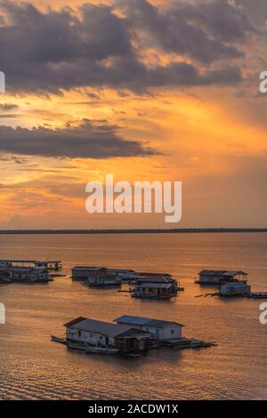Twilight hour over the swimming houses on Lake Tefé, small town of Tefé ...