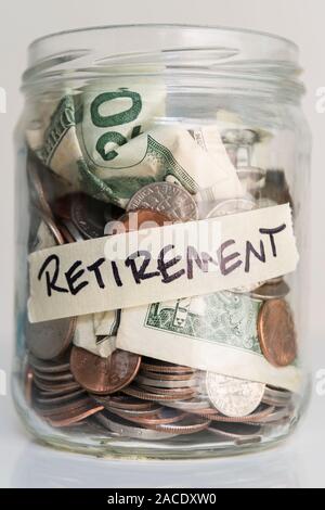 Glass jar labeled retirement Stock Photo - Alamy