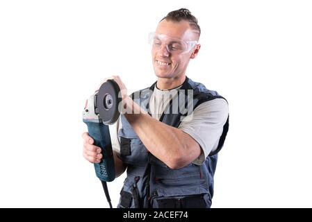 Builder working with angle grinder Stock Photo - Alamy