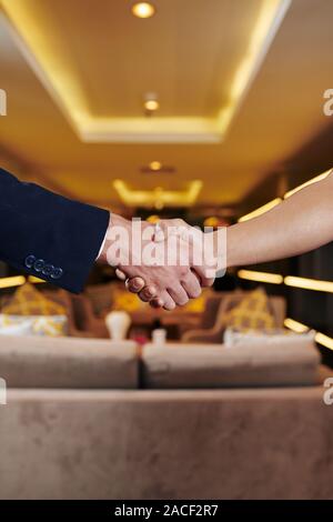 business people shaking hands firmly. concept of cooperation. close-up ...