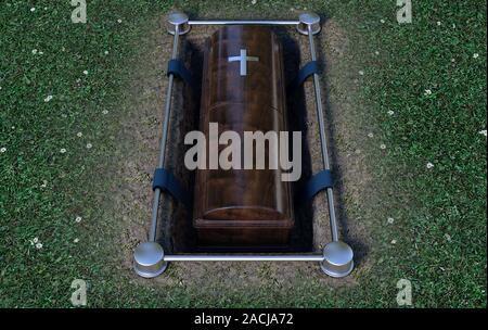 A modern wooden coffin at a funeral being lowered into a grave with a ...