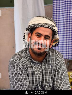 Handsome arabian man with traditional dress in the desert of Dubai ...