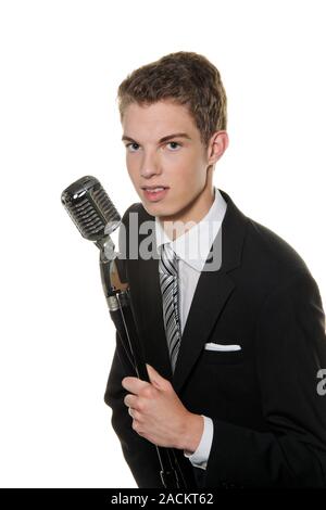 Young singer with retro microphone Stock Photo - Alamy