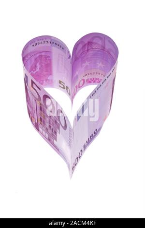 Euro banknote in the form of a heart Stock Photo - Alamy