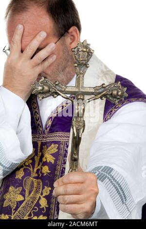Catholic priest desperate Stock Photo - Alamy
