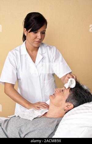 A nurse washes a patient Stock Photo - Alamy