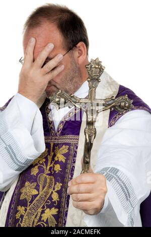 Catholic priest desperate Stock Photo - Alamy
