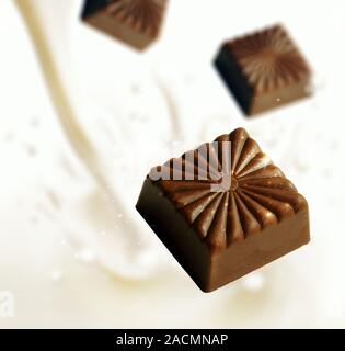 Chocolate falling into Milk Chocolate Stock Photo - Alamy