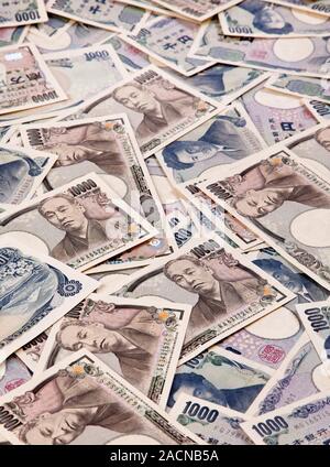 Yen banknotes, currency from Japan with handcuffs Stock Photo - Alamy