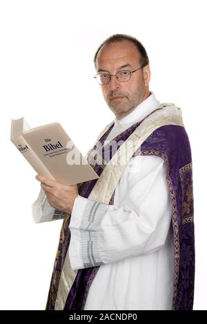 catholic priest with bible in church service Stock Photo - Alamy