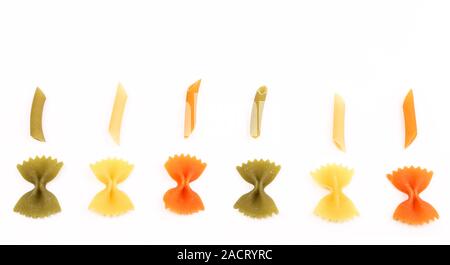 Composition of different pasta in three colors. White background Stock ...