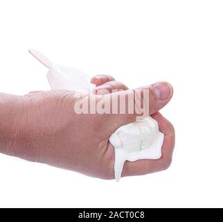 Hand presses vanilla ice cream on stick. White background Stock Photo ...