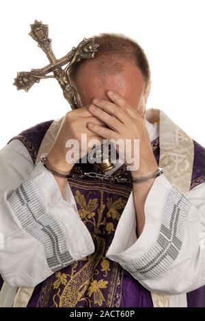 Abuse in church. Priest with handcuffs Stock Photo - Alamy