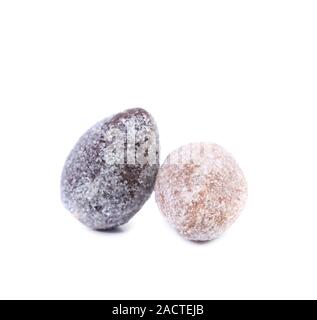 Chocolate stone powdered sugar. Close up. White background Stock Photo ...