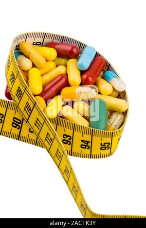 measuring tape with tablets Stock Photo - Alamy