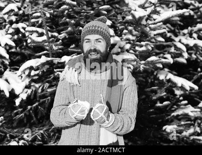 Macho with beard and mustache plays with snowball Stock Photo - Alamy