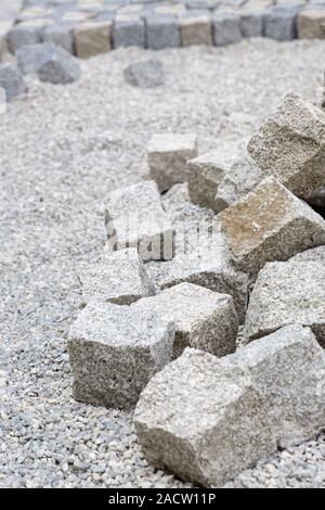 Laying granite stones Stock Photo - Alamy