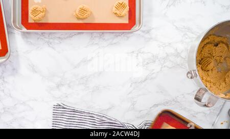 Flat lay. Step by step. Scooping peanut butter cookies dough with dough ...