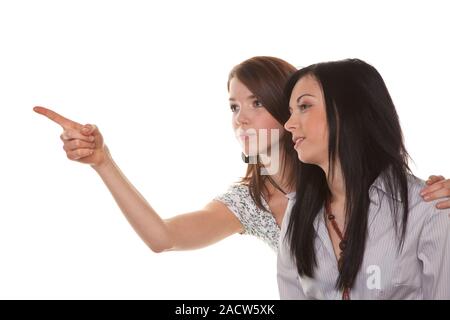 Two young women burst into laughter Stock Photo - Alamy