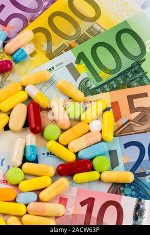 Euro banknotes and tablets Stock Photo - Alamy