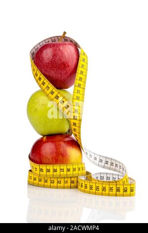 Apples on with tape measure Stock Photo - Alamy