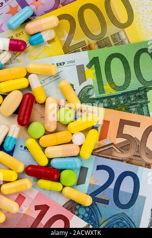 Euro banknotes and tablets Stock Photo - Alamy