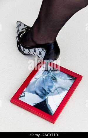 Picture frame and stiletto shoe Stock Photo - Alamy