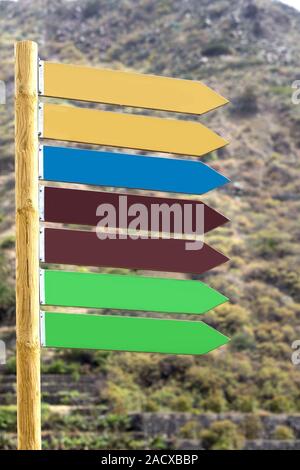 Colourful signposts point in one direction Stock Photo - Alamy