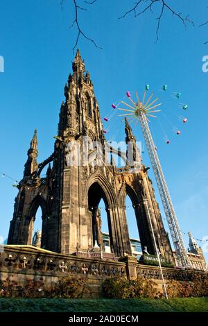 Fairground ride star flyer and Scott monument at Edinburgh Christmas ...