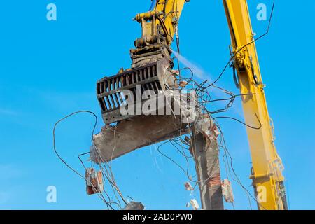 Large demolition crane claw dismantling a building Stock Photo - Alamy