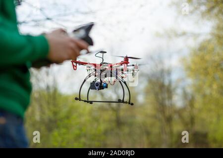 Man flying drone at a river Stock Photo - Alamy