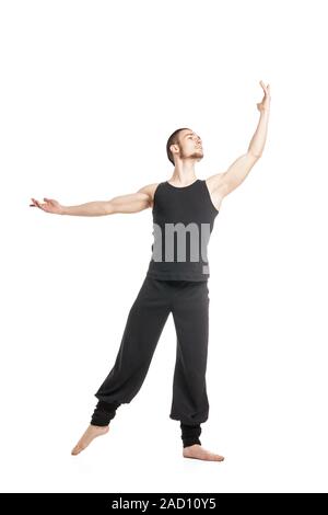 Young ballet dancer with arm raised against white background Stock ...