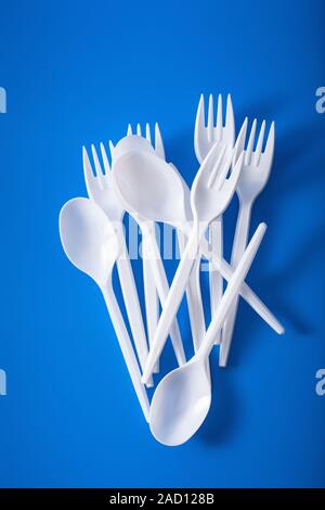 single use plastic forks, spoons. concept of recycling plastic, plastic ...