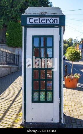 vintage rotary pay phone in booth Stock Photo - Alamy