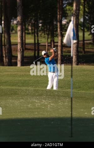 pro golfer hitting a sand bunker shot Stock Photo - Alamy