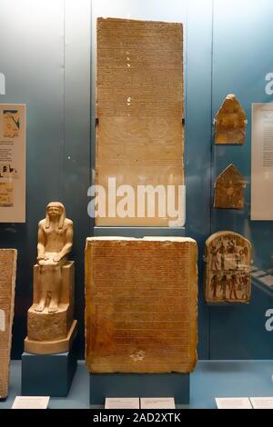 Limestone seated figure of Intef and limestone stela in The British ...