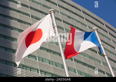 Japanese and French flags at the Nissan Motor Co., Ltd. Global ...