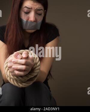 Unhappy woman with sealed mouth Stock Photo - Alamy