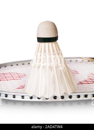 Badminton feather shuttlecocks on badminton racket over a yellow ...