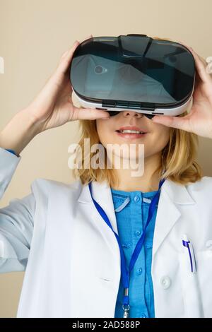 Girl in virtual reality mask experiencing virtual technology wor Stock ...