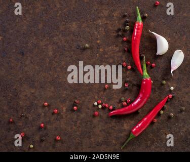cayenne chilli peppers on rusty metal background Stock Photo - Alamy