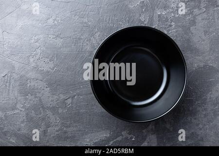 Top view of empty grey plate on wooden background. Empty space for your ...