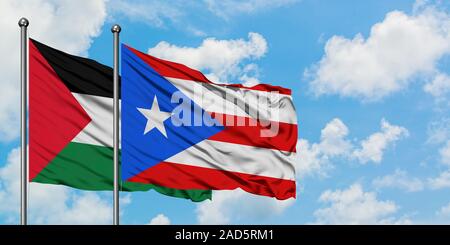 Puerto Rico and Palestine flag waving in the wind against white cloudy ...