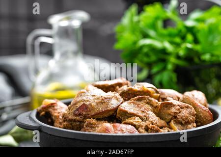 roasted pork and innards with chicken liver stab in wooden stick on ...