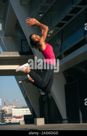 Full body length photo of jumping trampoline man holding astonished ...