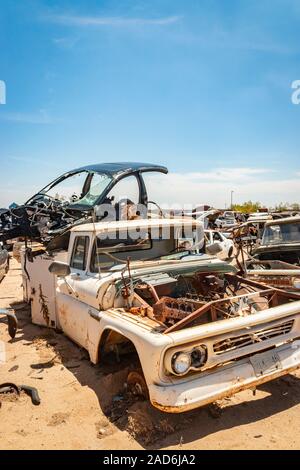 abandoned rusty cars and trucks with a 1952 Pontiac Chieftain in a junk ...