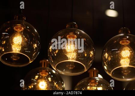Decorative mason jar style yellow light bulbs Stock Photo - Alamy